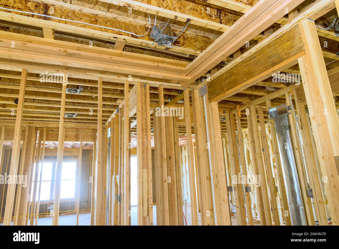 Under construction is new, unfinished wood frame, consisting of wooden ...