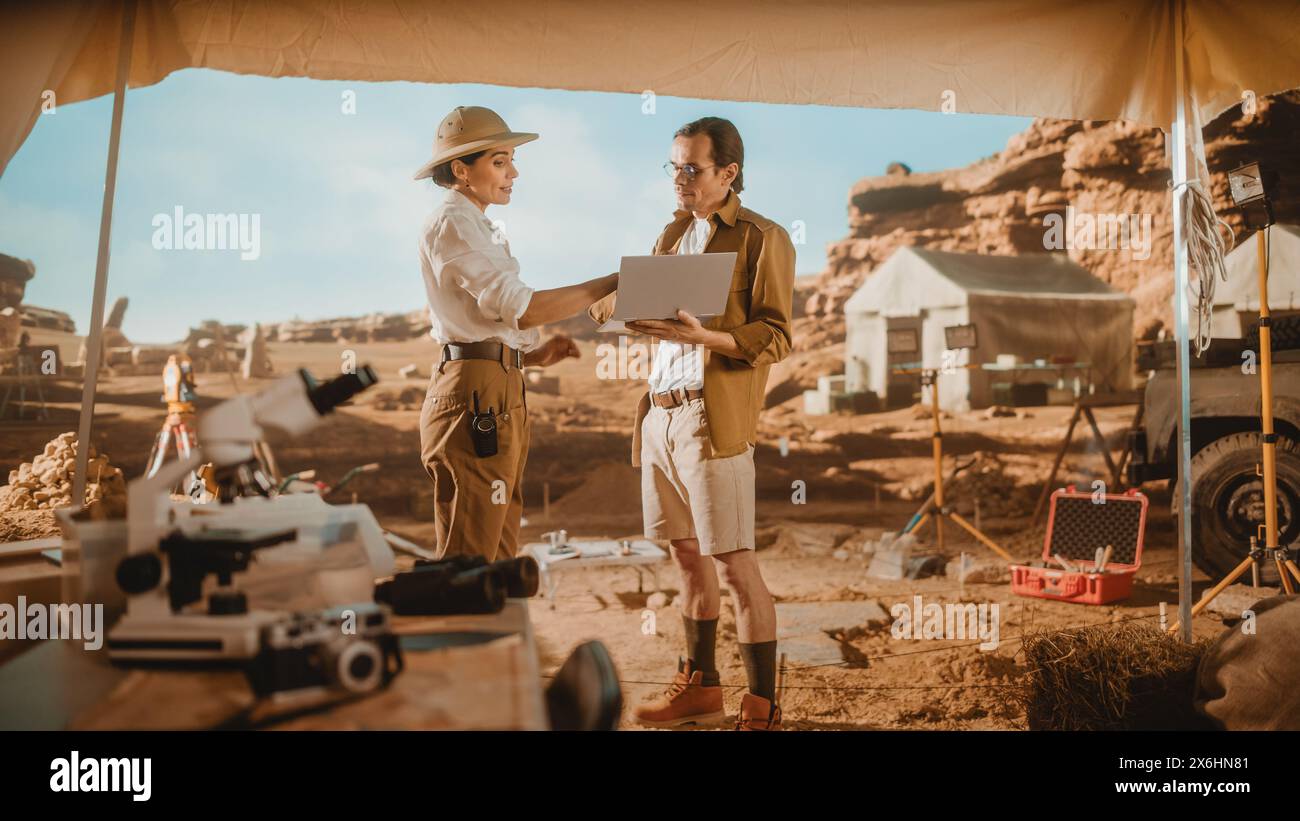 Archaeological Digging Site: Two Great Archeologists Stand in Tent Work ...
