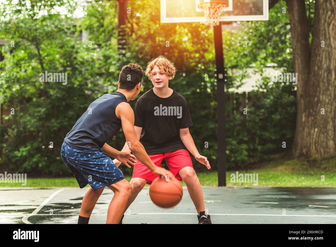Teens playing basketball outside hi-res stock photography and images ...