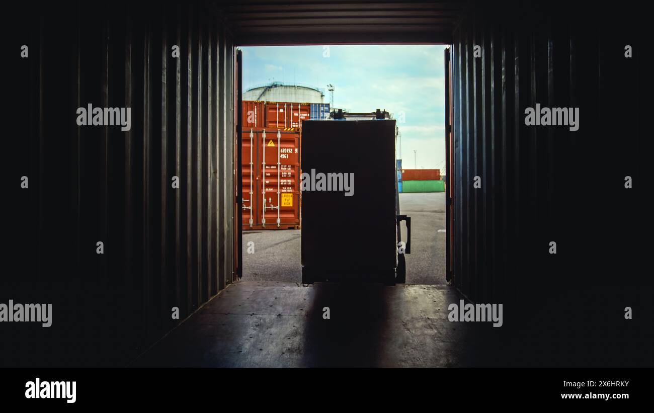Forklift Driver Loading or Unloading a Shipping Cargo Container with a ...