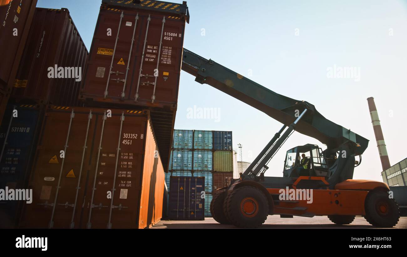 Modern Container Handler Carrying a Large Red Steel Shipping Cargo ...