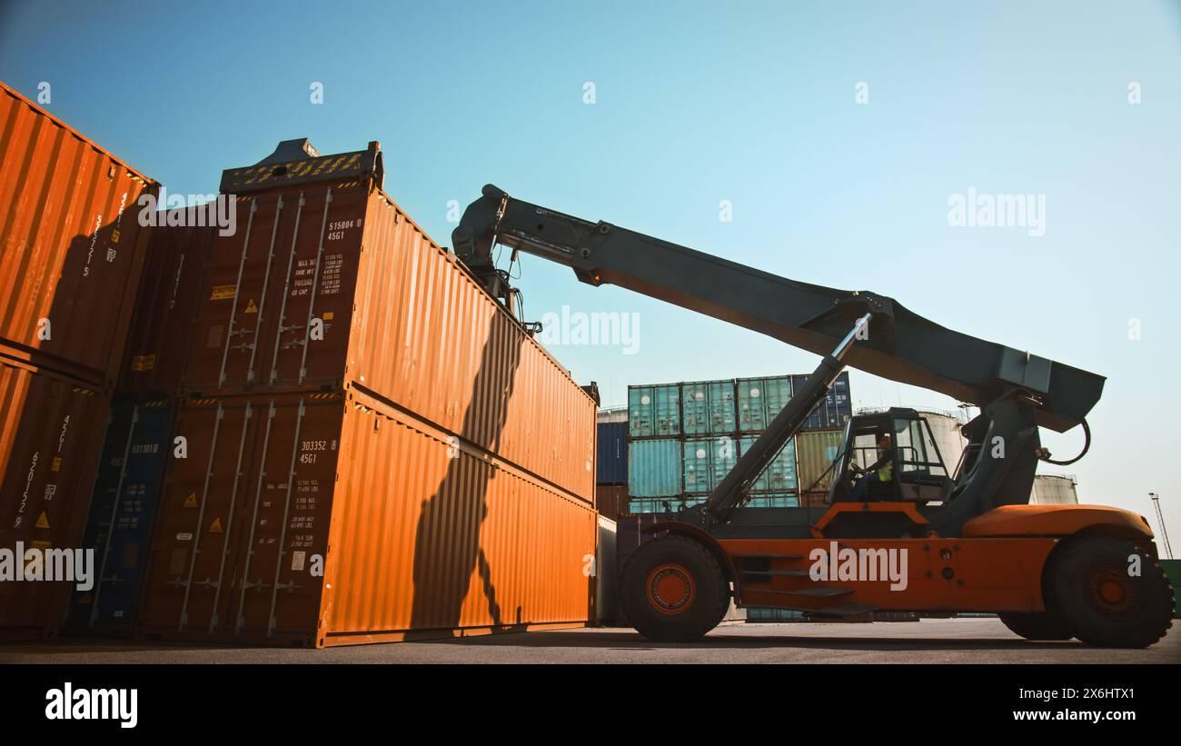 Modern Container Handler Carrying a Large Red Steel Shipping Cargo ...