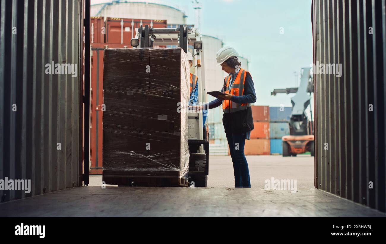 Forklift Driver Loading a Shipping Cargo Container with a Full Pallet ...