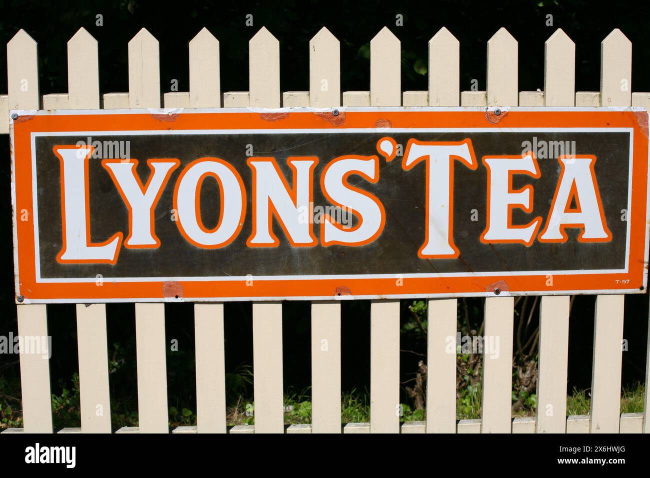 Lyons tea advertisement on railway station fence Stock Photo - Alamy