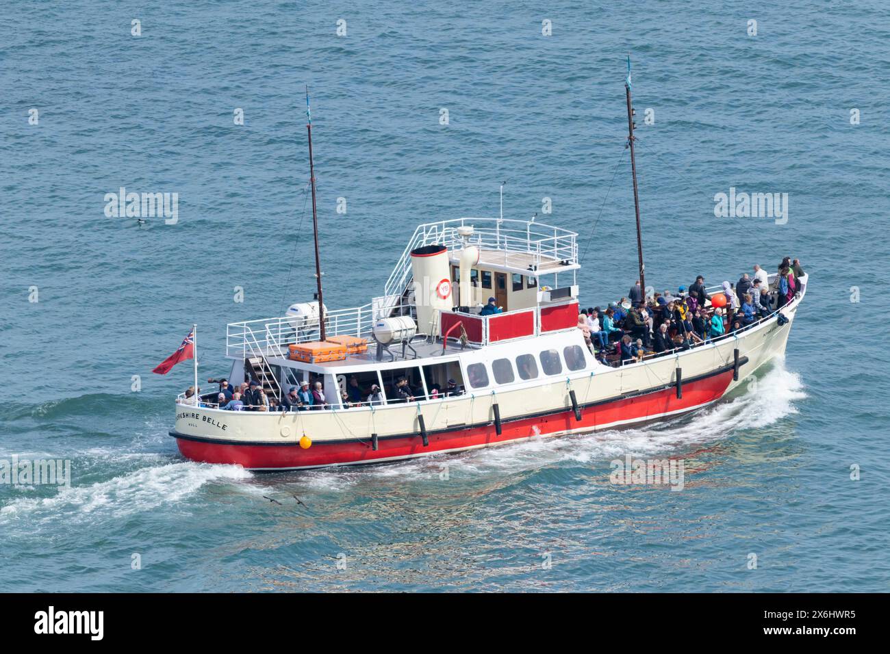 Viewed from Bempton Cliffs tourists on a boat trip on The Yorkshire ...
