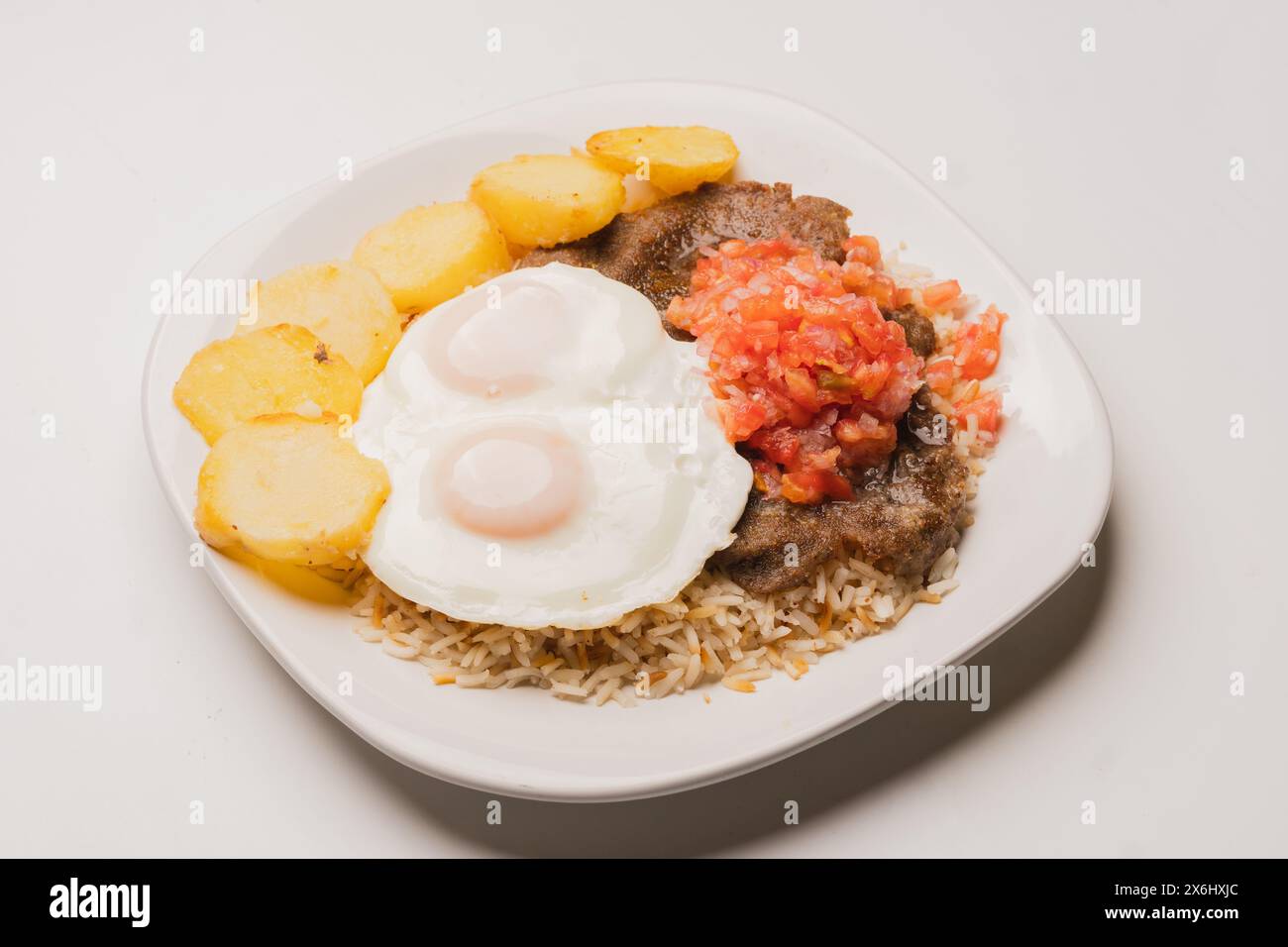 Authentic, traditional Bolivian meal: Silpancho, made of beef, potatoes ...