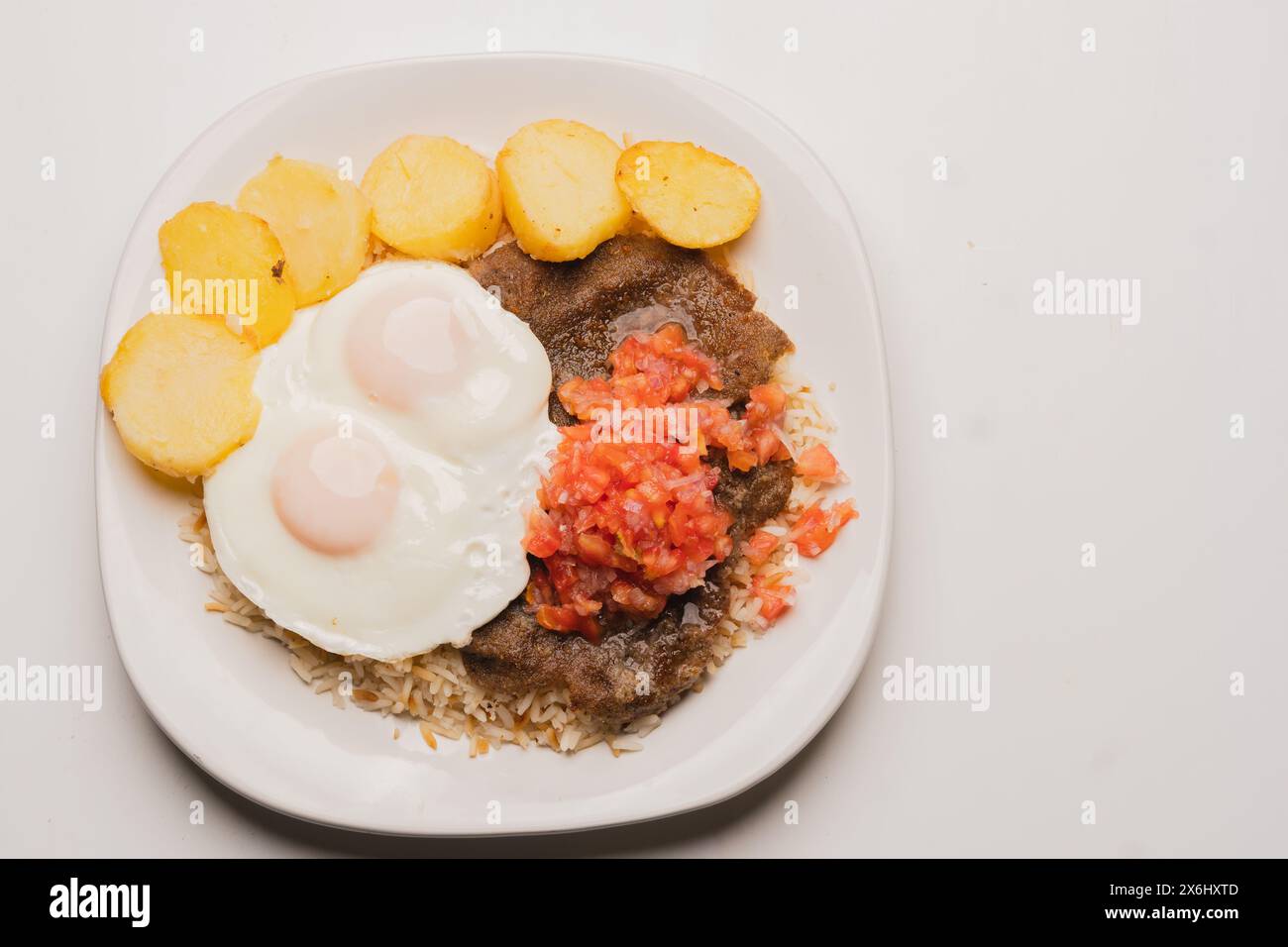 Authentic, traditional Bolivian meal: Silpancho, made of beef, potatoes ...