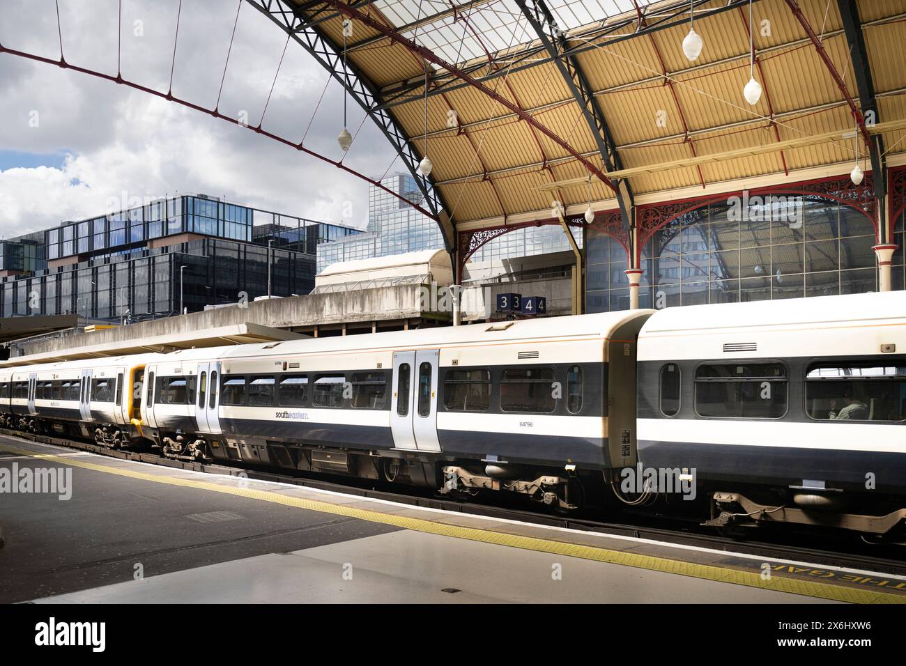 South Eastern train at London Victoria station. Modern train on ...