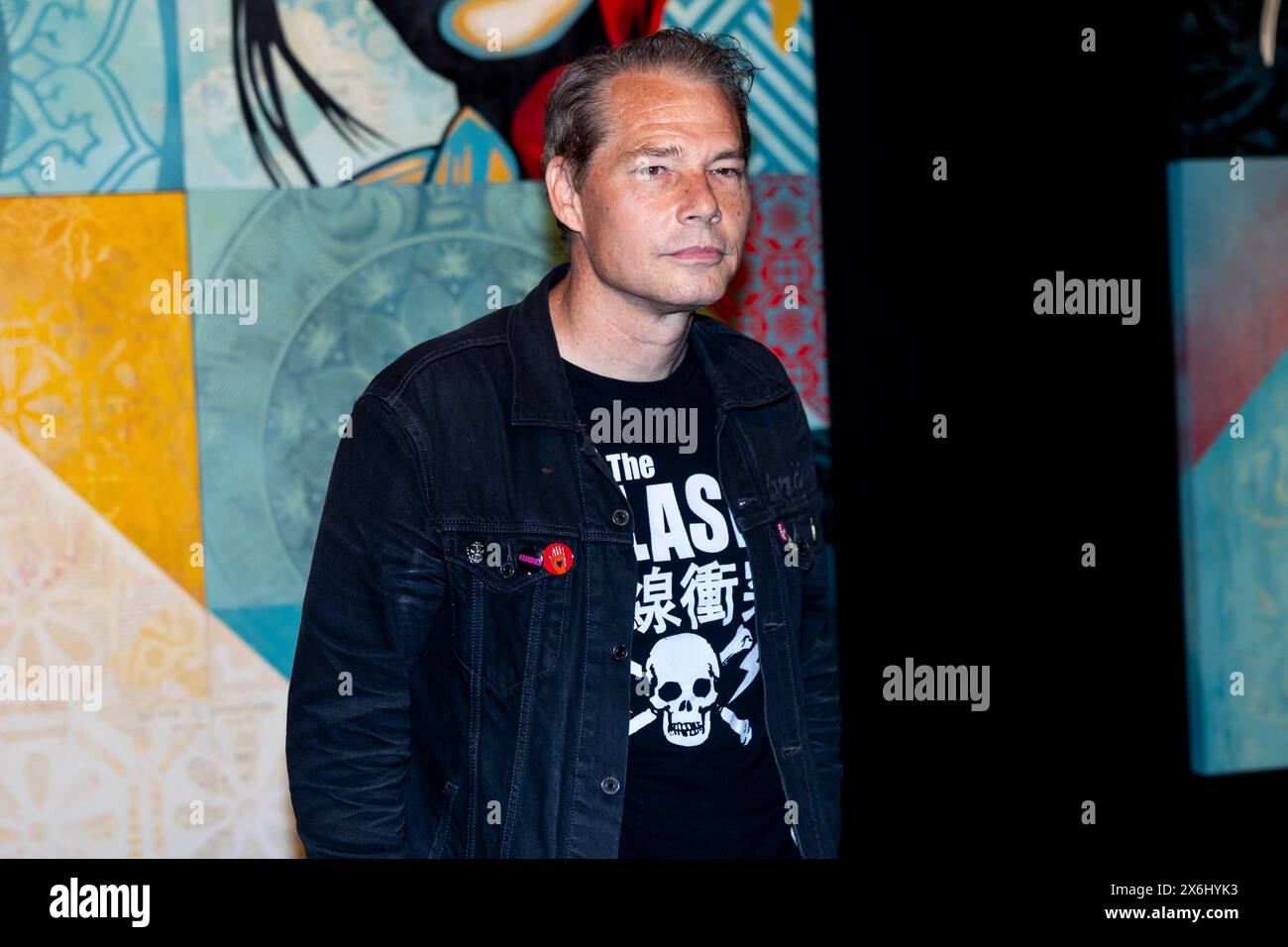 Shepard Fairey poses for a portrait during the opening of the ...