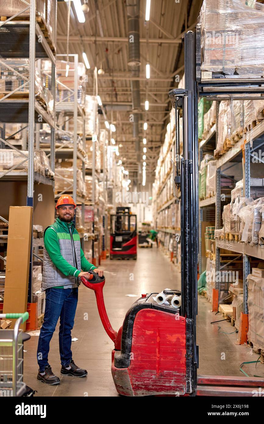 engineer staff male warehouse worker in hard hat working. in logistics ...