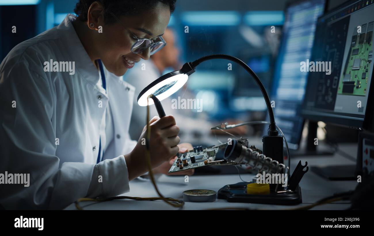 Modern Electronics Research and Development Facility: Beautiful Black Female Engineer Does ...
