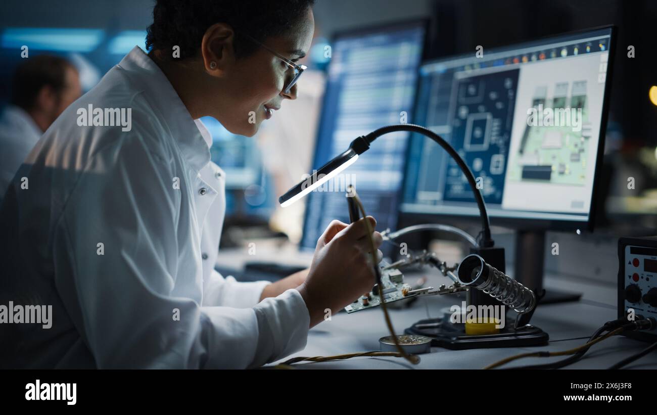 Modern Electronics Research and Development Facility: Beautiful Black Female Engineer Does ...