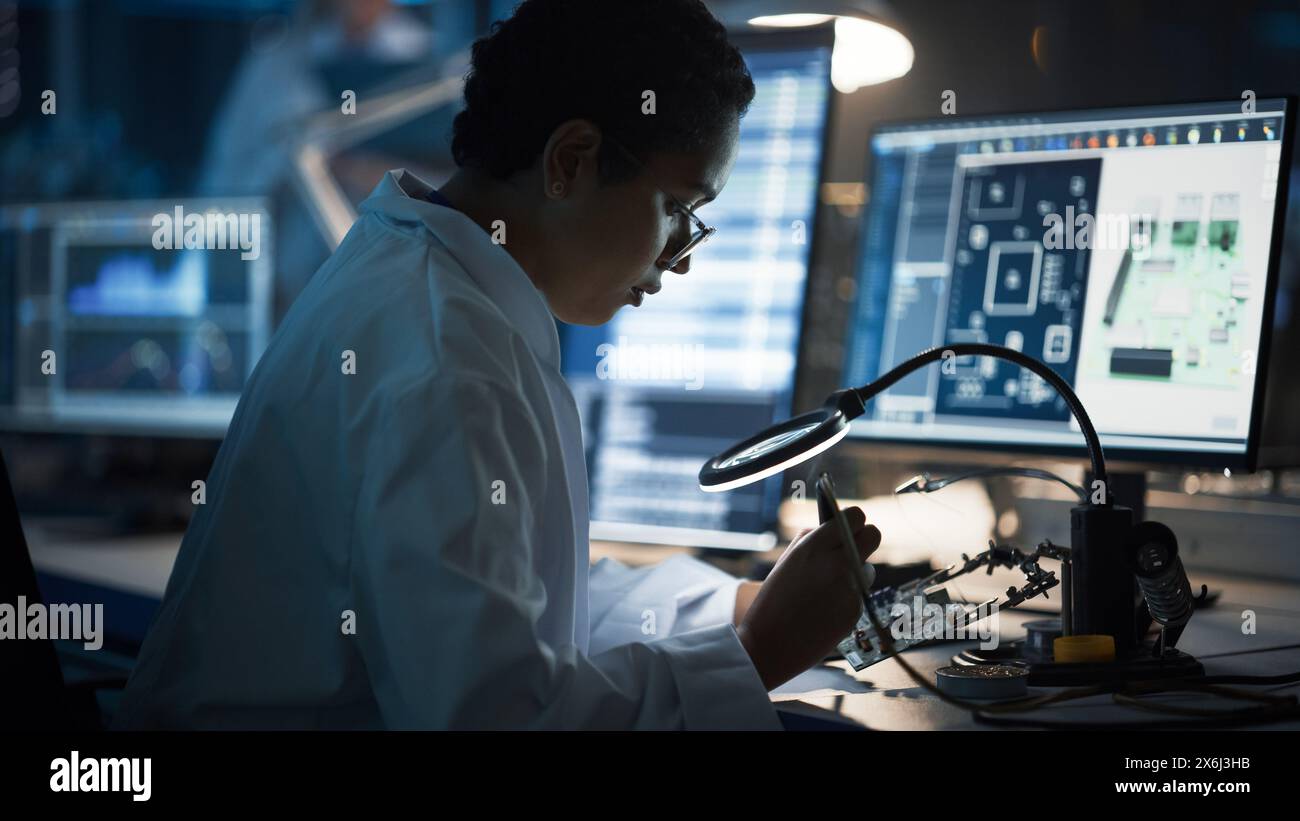 Modern Electronics Research, Development Facility: Black Female Engineer Does Computer ...