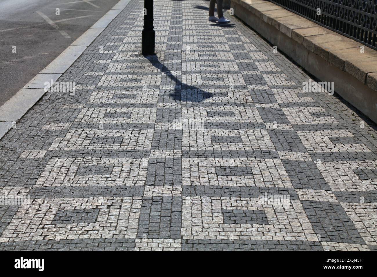 Sidewalk cobblestone pavement patterns in Prague city, Czech Republic ...