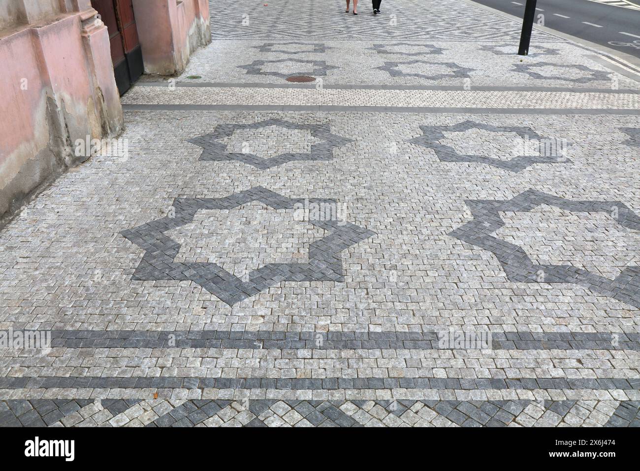 Sidewalk cobblestone pavement patterns in Prague city, Czech Republic ...