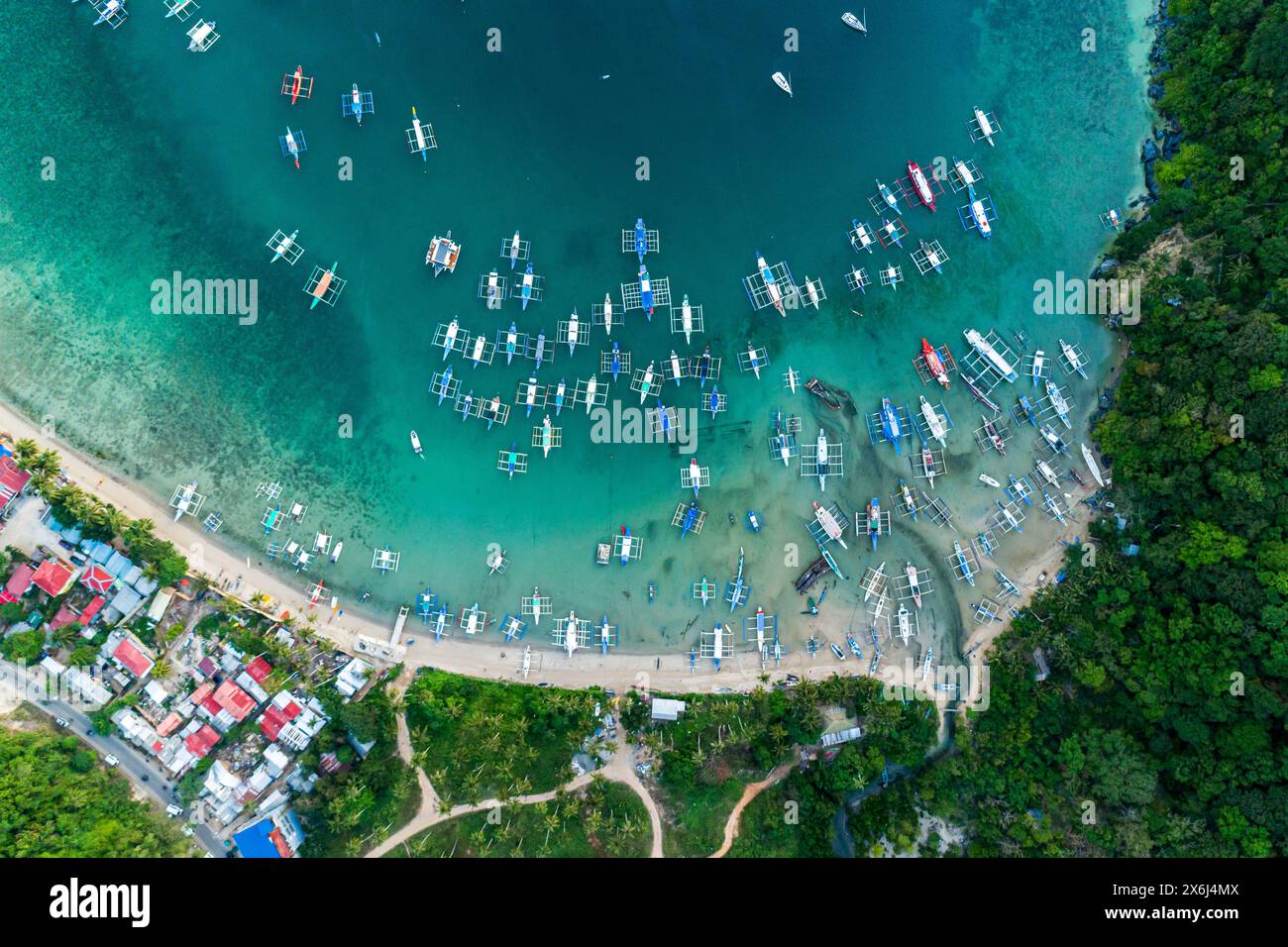 Top drone view of a traditional philippine boats on the surface of the ...