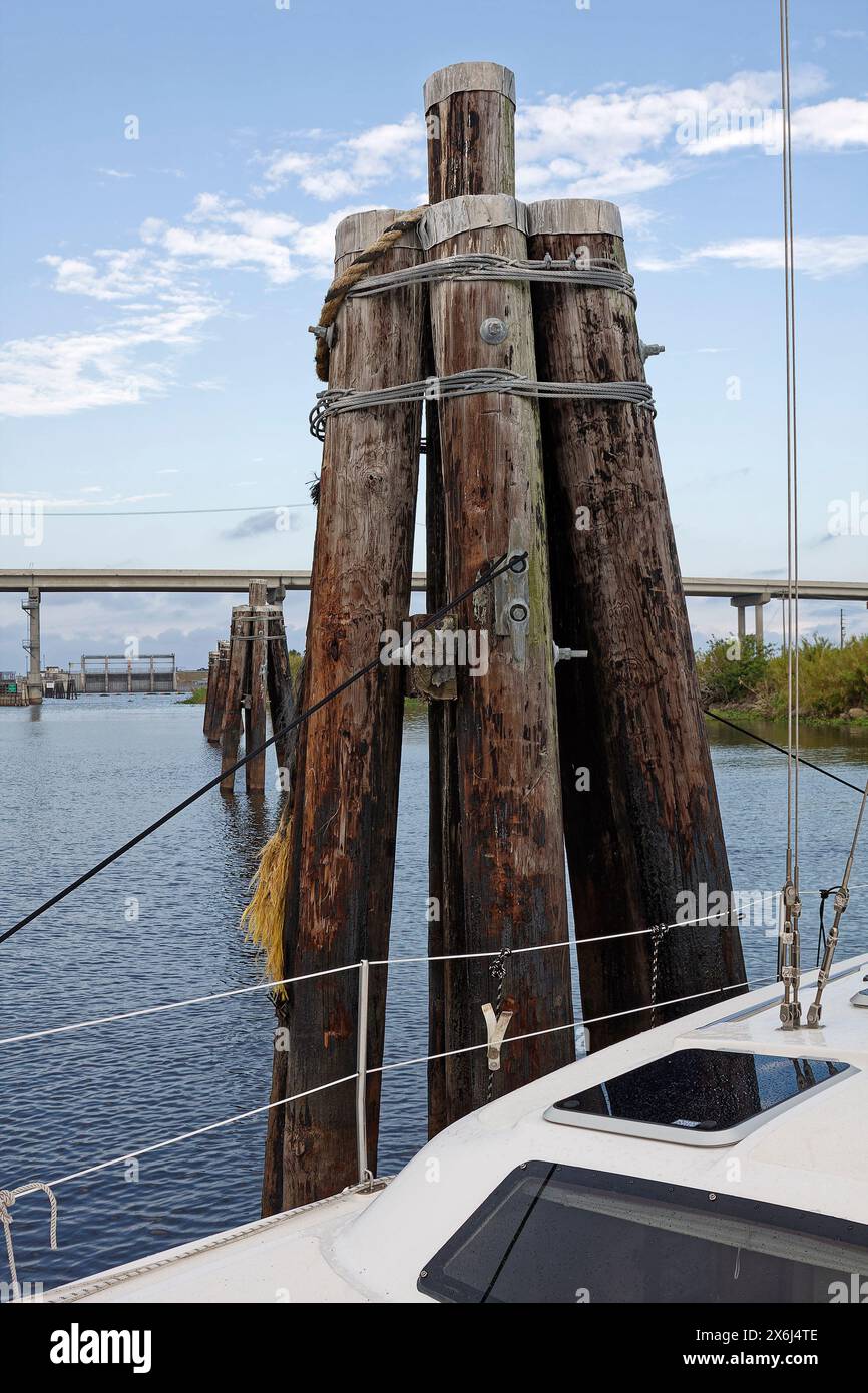 sailboat tied to wood piling group, ICW, Atlantic Intracoastal Waterway ... sailboat tied to wood piling group, ICW, Atlantic Intracoastal Waterway ...