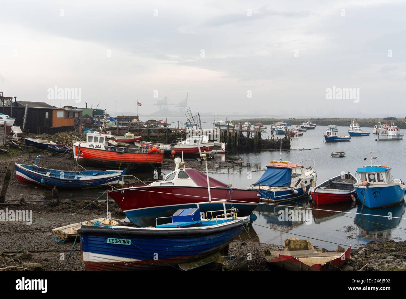 South Gare, nr. Redcar, North Yorkshire, UK.Boatyard in a small harbour ...