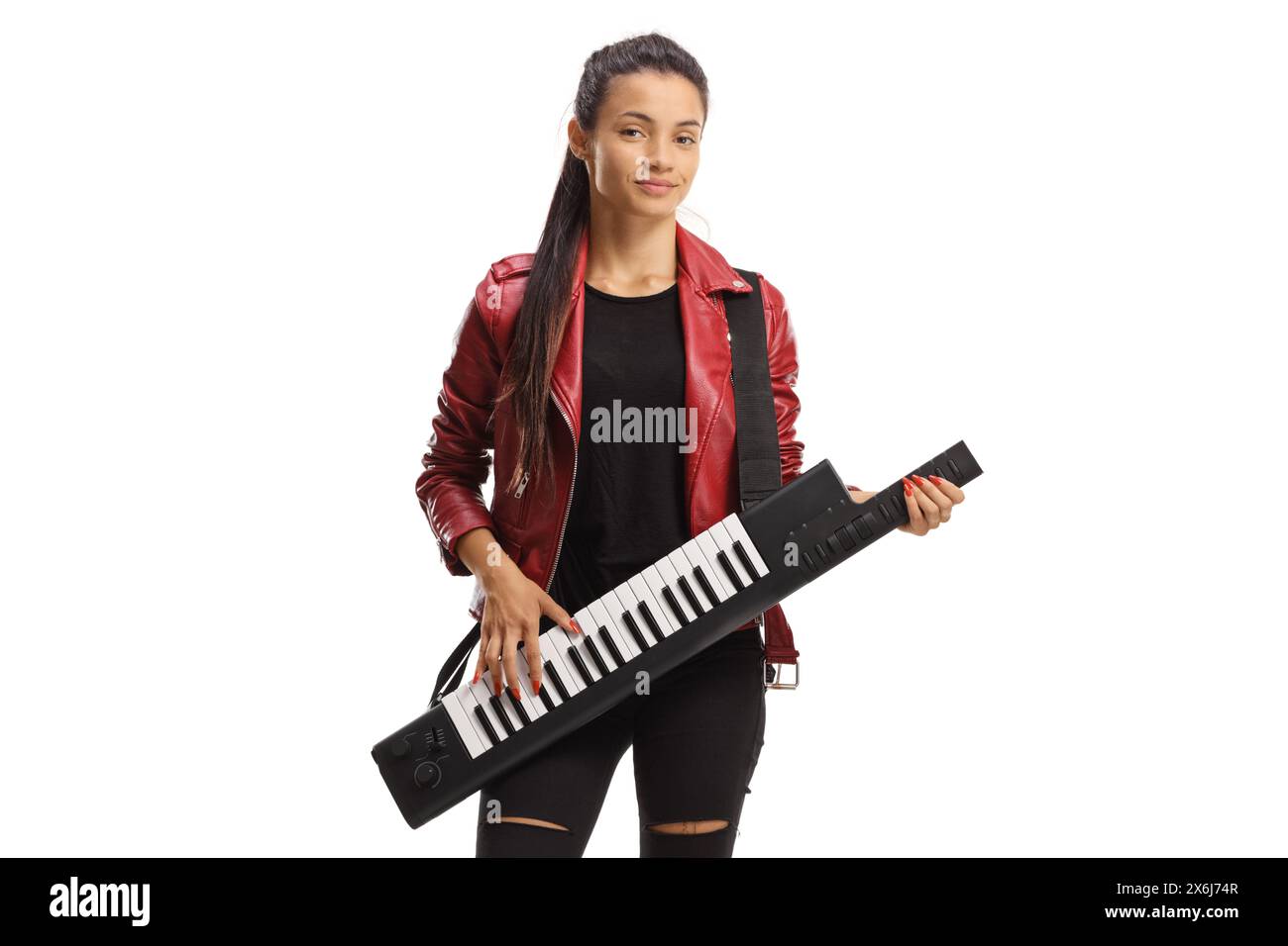 Female musician playing a keytar and standing isolated on white ...