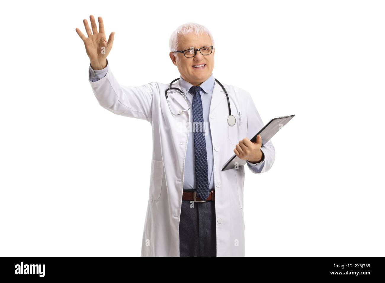 Mature doctor standing and waving isolated on white background Stock ...