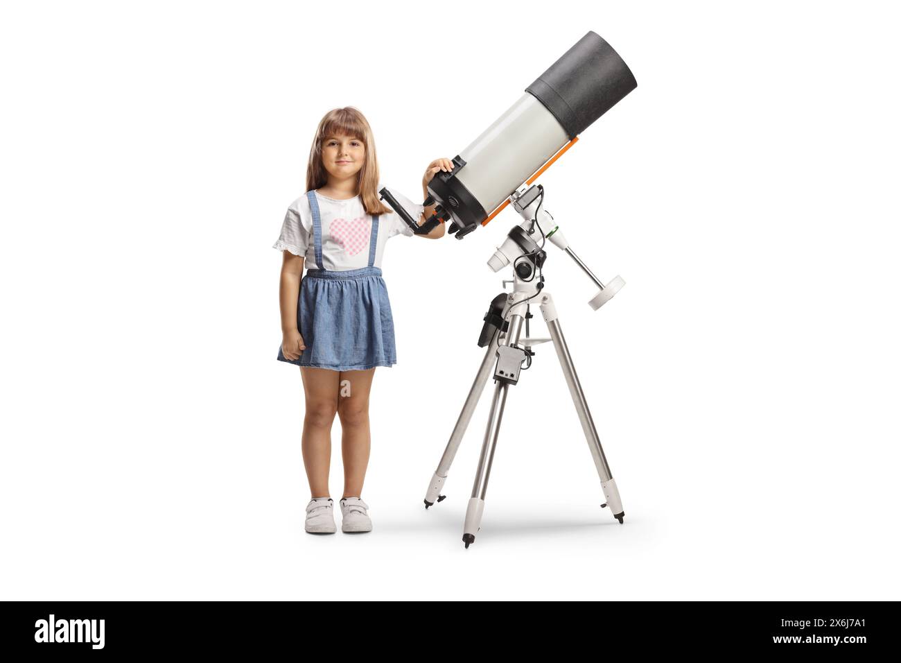 Little girl standing next to a telescope isolated on white background ...
