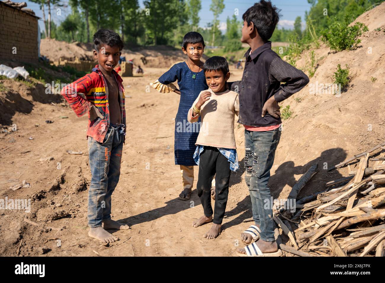 Local boys poses for a photo on a sunny day Stock Photo - Alamy