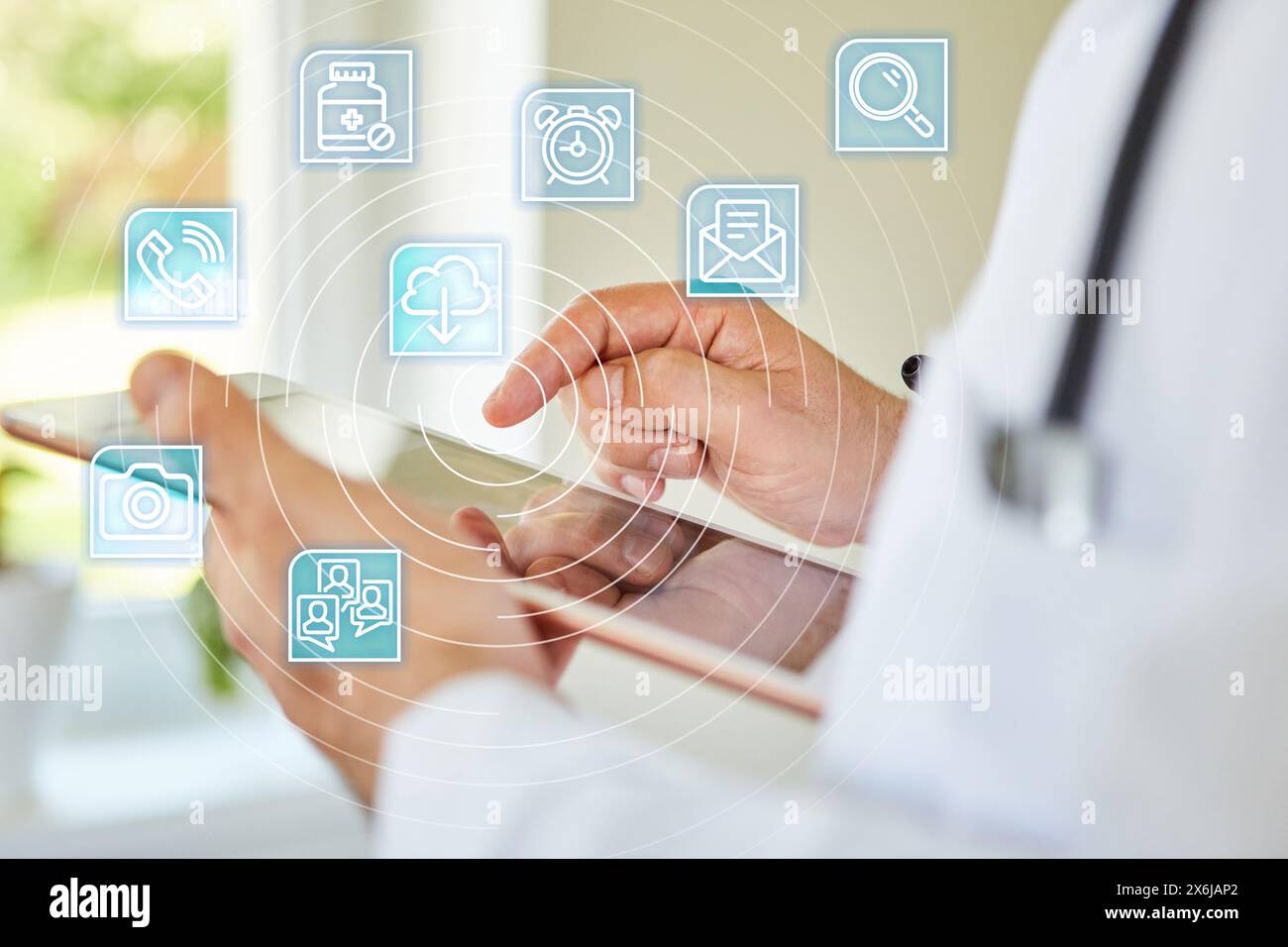 Finger of doctor operating touch screen on tablet computer during ...
