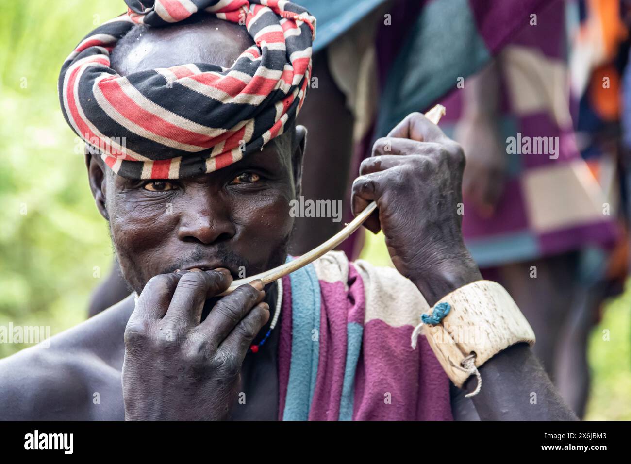 Members of the Mursi tribe in Ethiopia eat freshly hunted bush meat ...