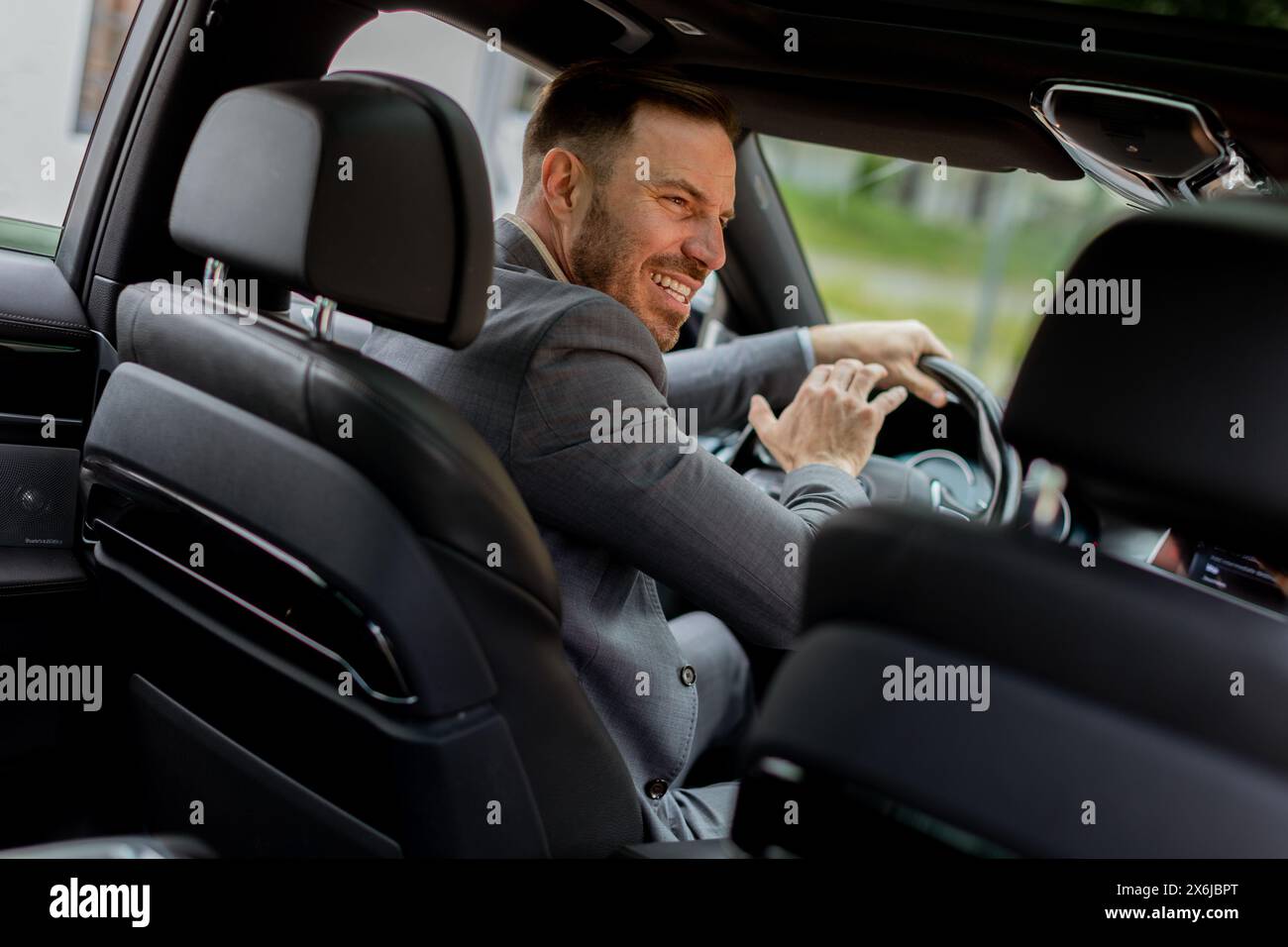 Man in a suit appears to be shouting during traffic jam behind the ...