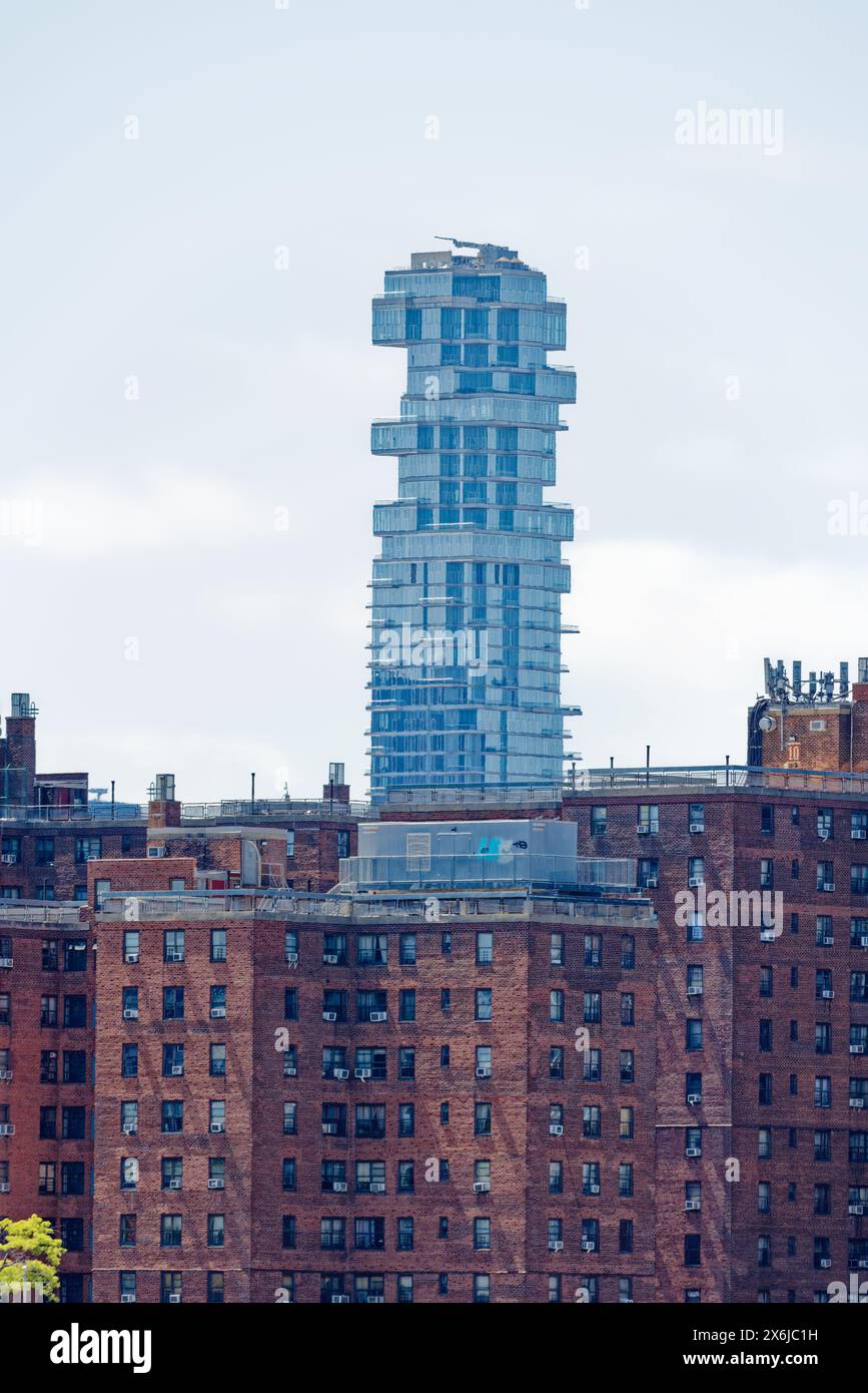 Tribeca’s famed glass “Jenga Building” looms in the haze beyond the red ...