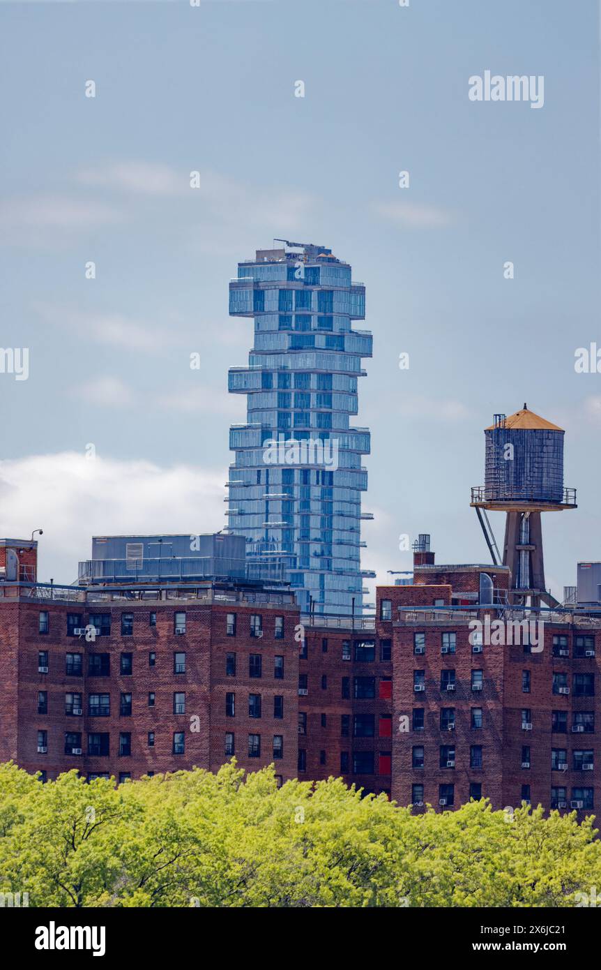 Tribeca’s famed glass “Jenga Building” looms in the haze beyond the red ...