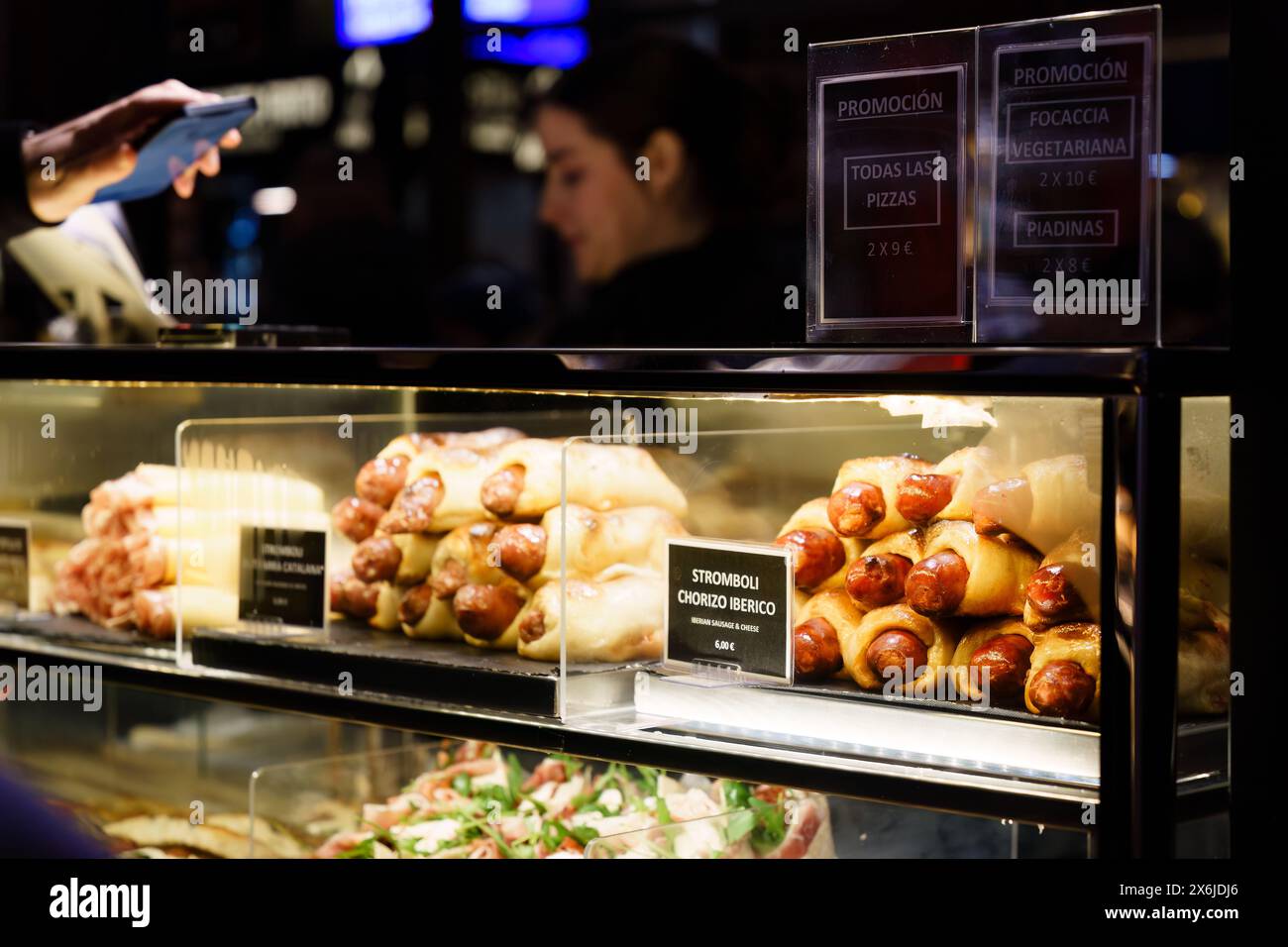 Madrid, Spain. February 11, 2024 - Variety of sausage rolls on display ...