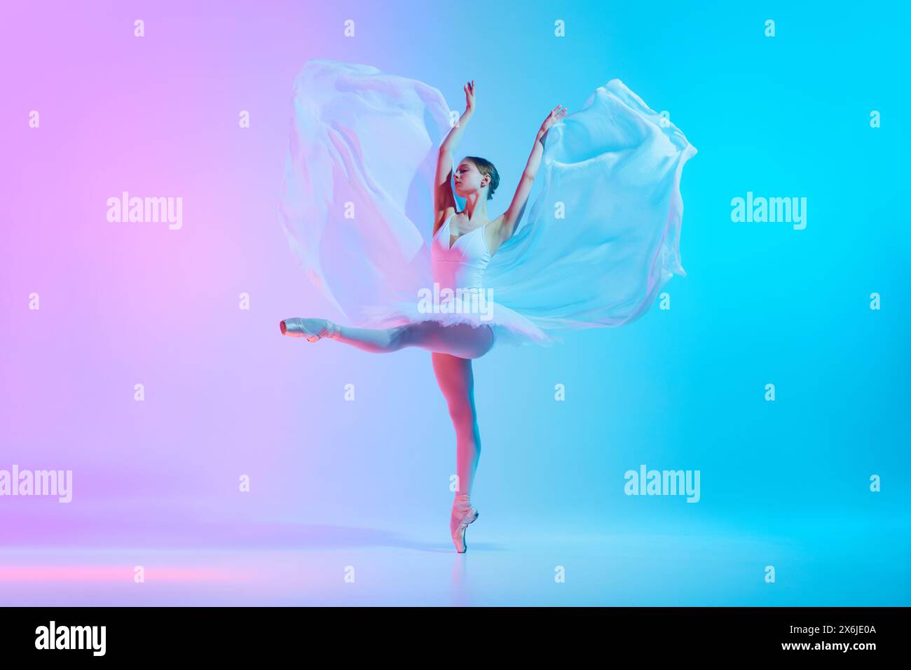 Timeless grace. ballet dancer in white tutu dancing with white flowing ...
