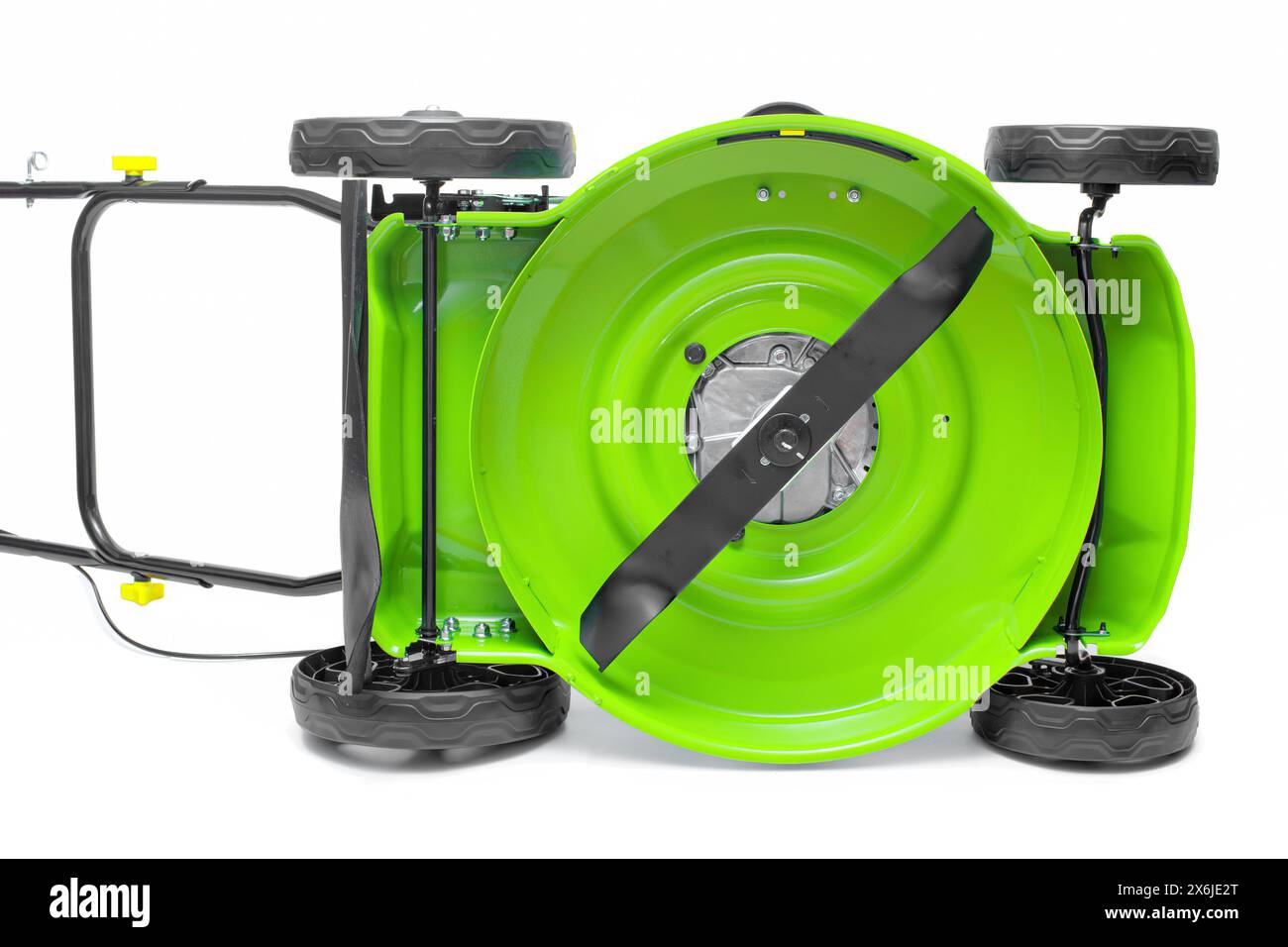 Brand new green color lawn mower showing the cutting blade Stock Photo ...