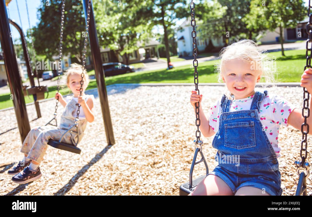 Happy 3 years old girl on a swing. Happy kid on playground Stock Photo ...