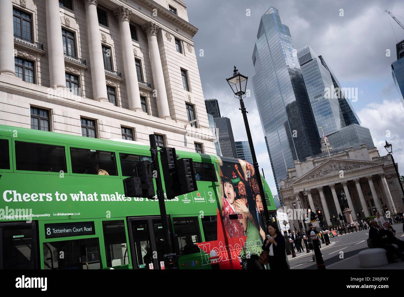 A London bus drives through Bank junction in the heart of the City of ...