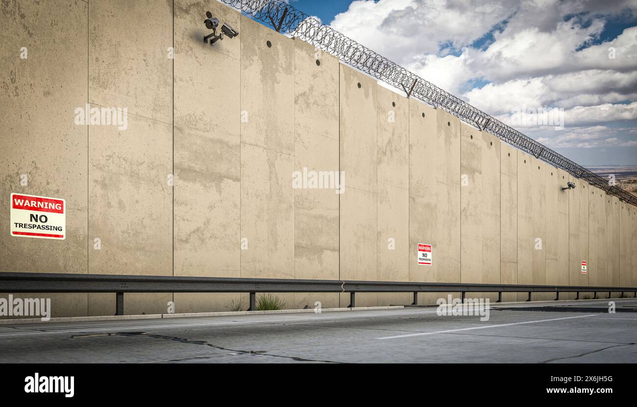 border concrete wall topped barbed wire no trespassing warning signs ...