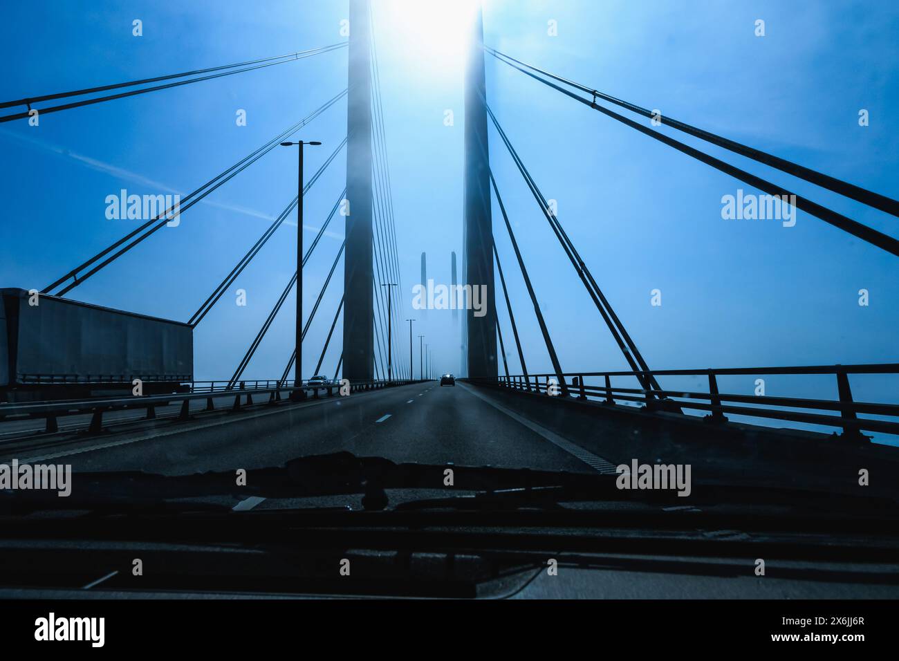 High-speed road bridge view from a fast-moving car. Road and railway ...
