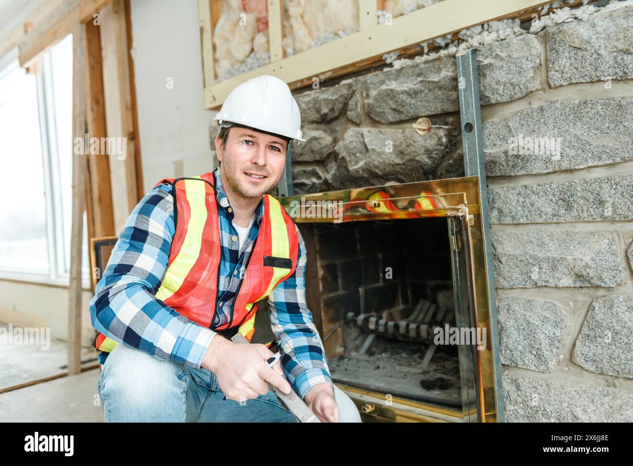 Inspector with white helmet inspecting an old house to be sure ...