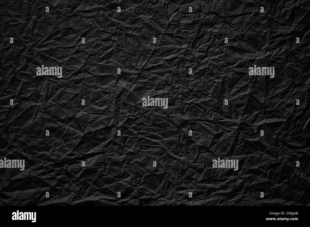 black paper background, crumpled template texture for inserting text ...