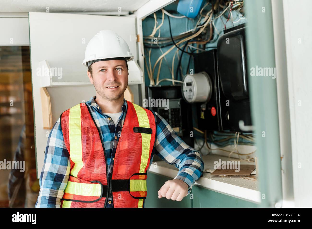 Inspector with white helmet inspecting an old house to be sure ...