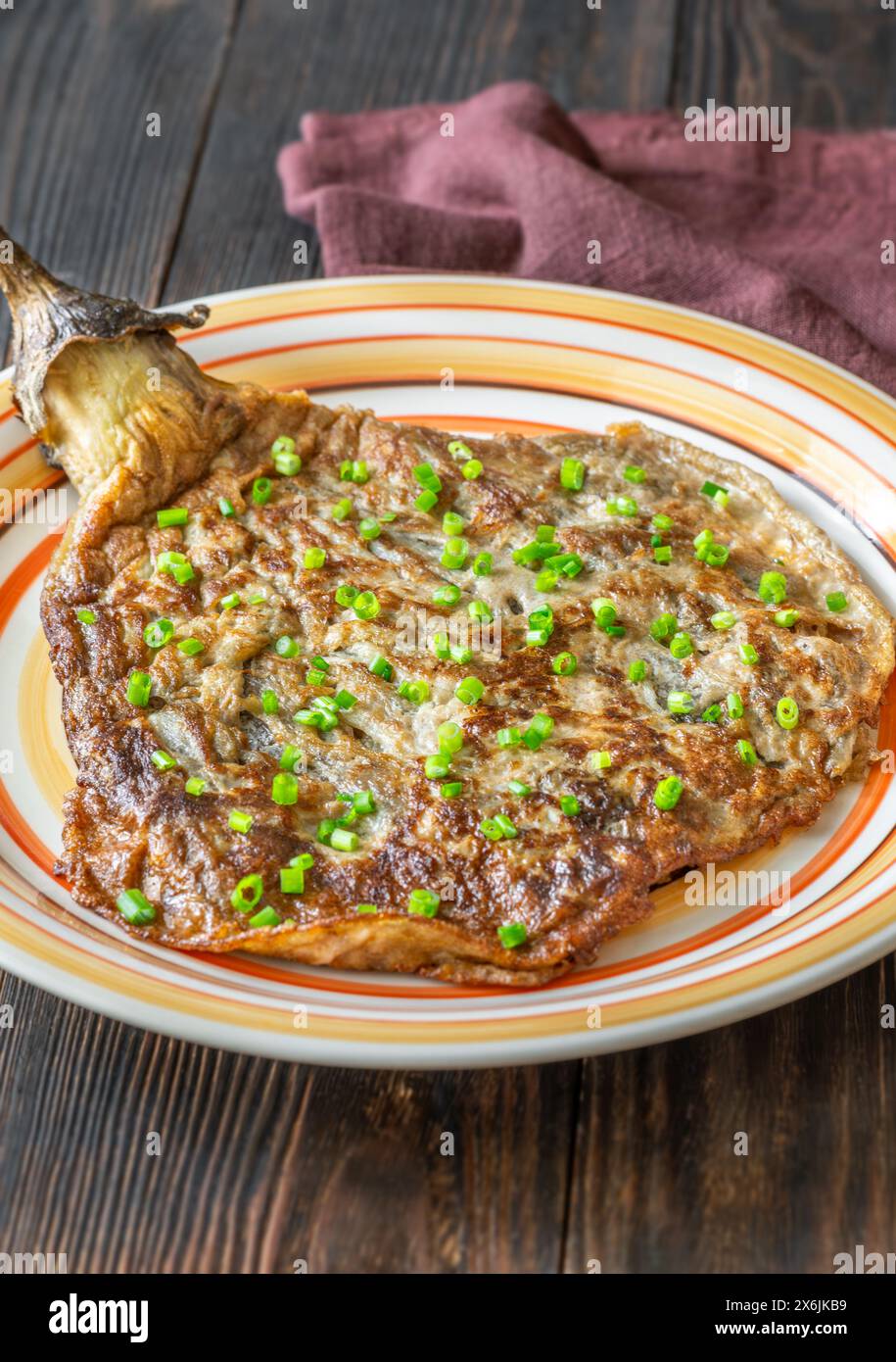 Tortang Talong filipino eggplant omelette on the plate Stock Photo - Alamy