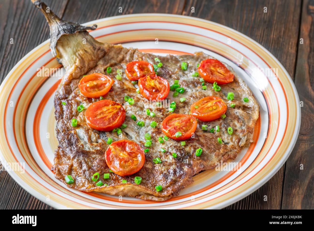 Tortang Talong filipino eggplant omelette on the plate Stock Photo - Alamy