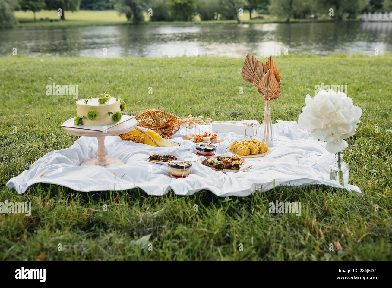 Lakeside Picnic Feast on the park Stock Photo - Alamy