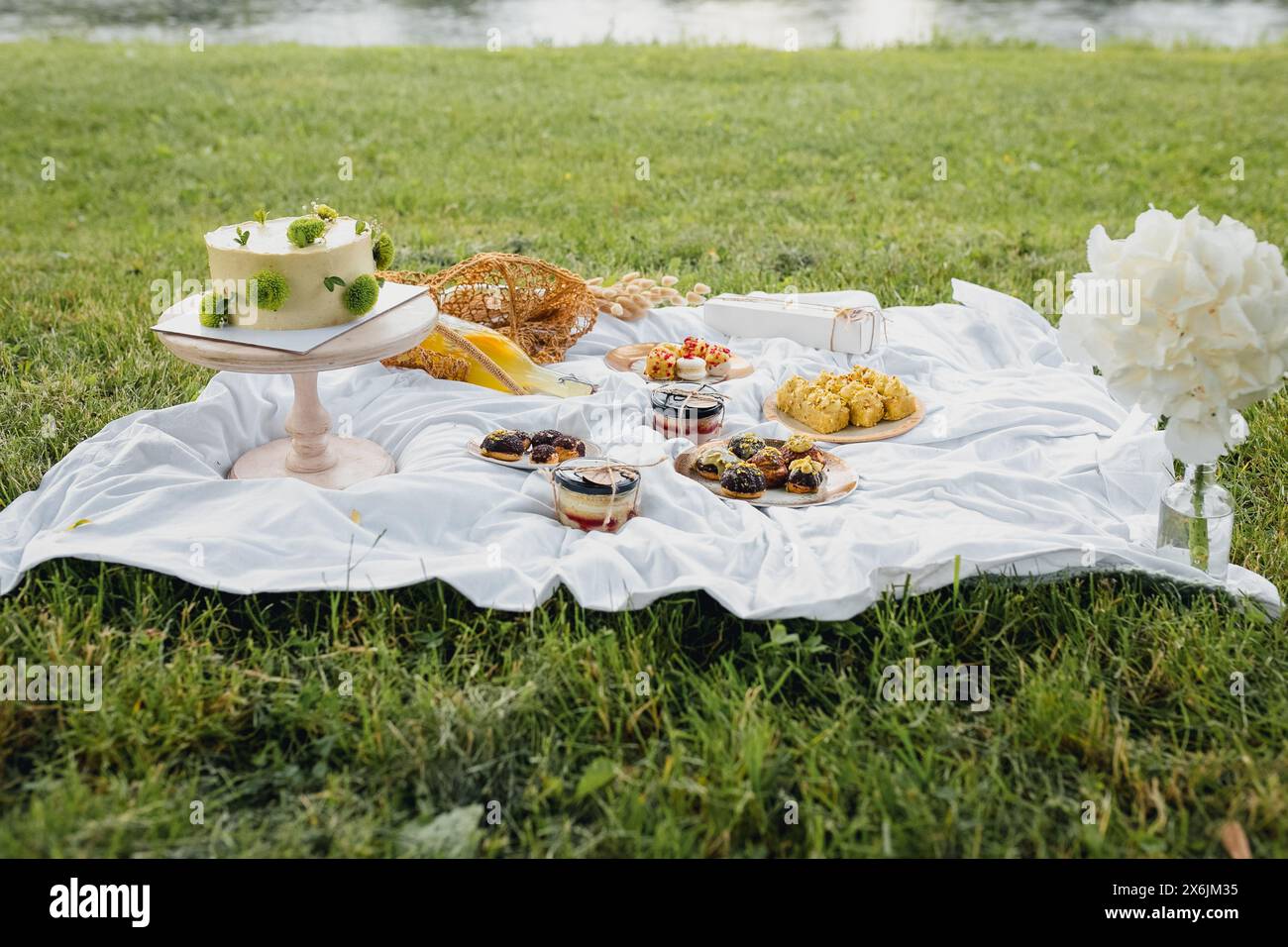Lakeside Picnic Feast on the park Stock Photo - Alamy