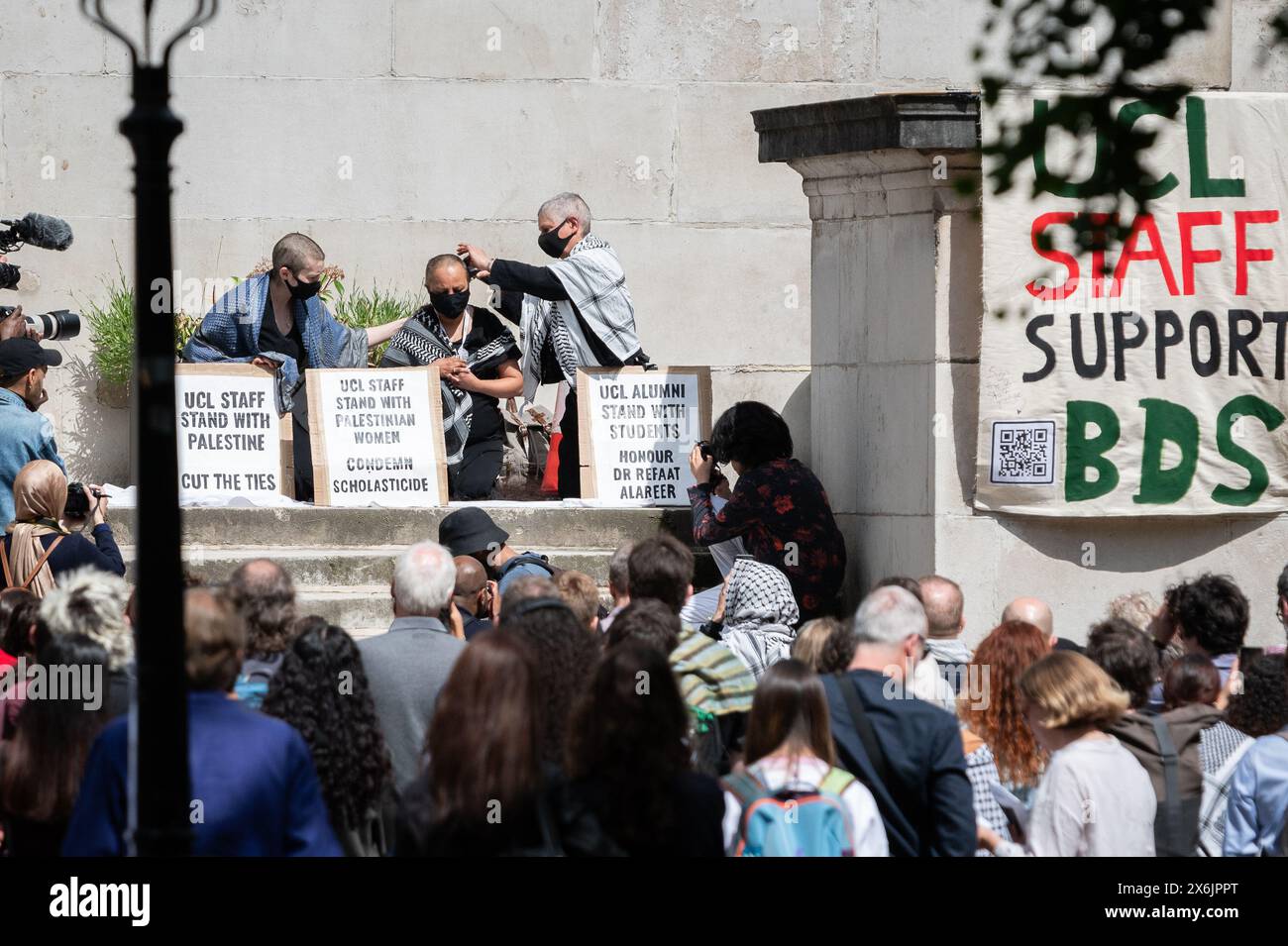 London, UK. 15 May, 2024. Members of UCL staff shave their heads in ...