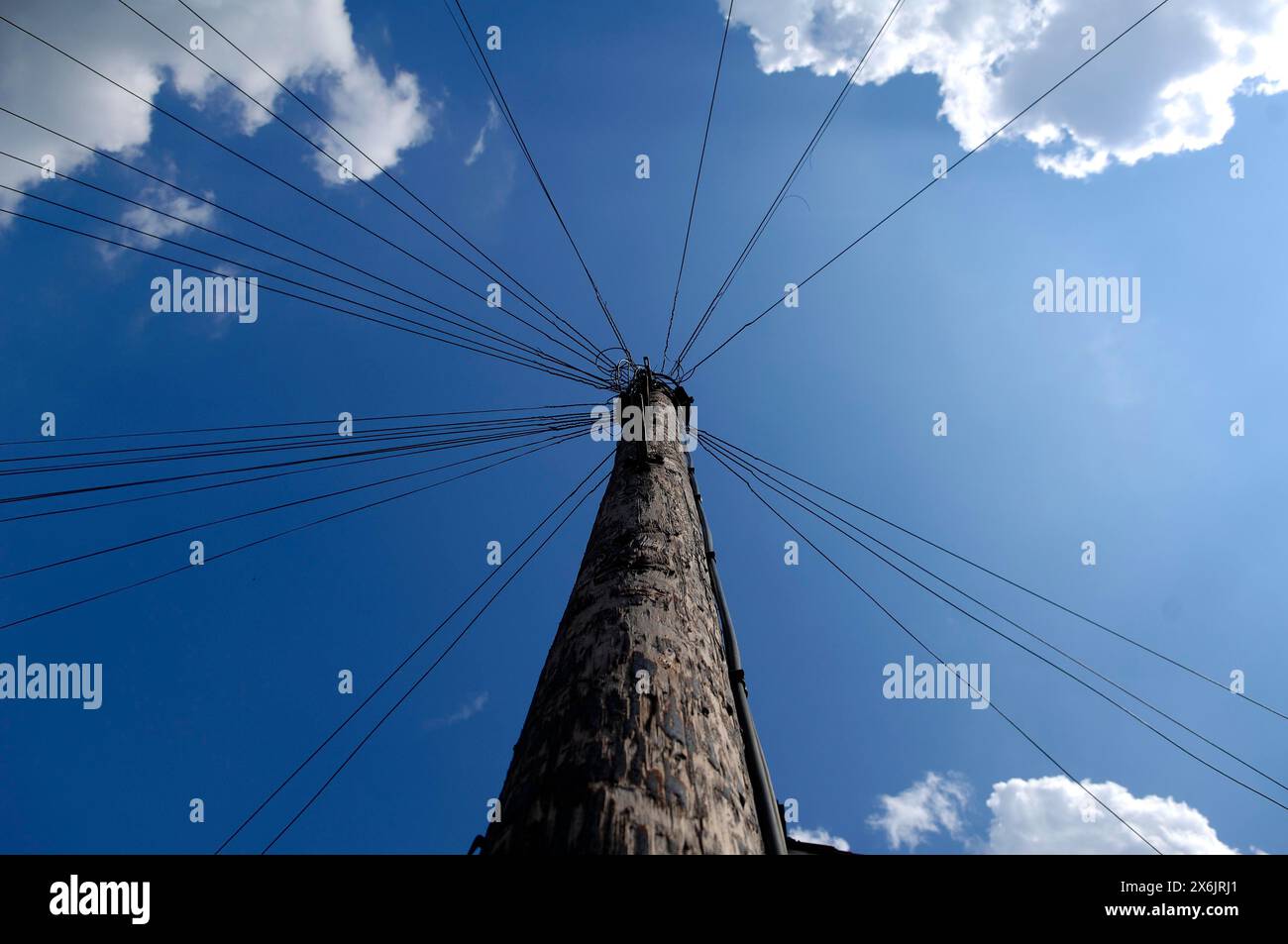 Telephone pole against blue sky in the suburb of London, Tooting ...