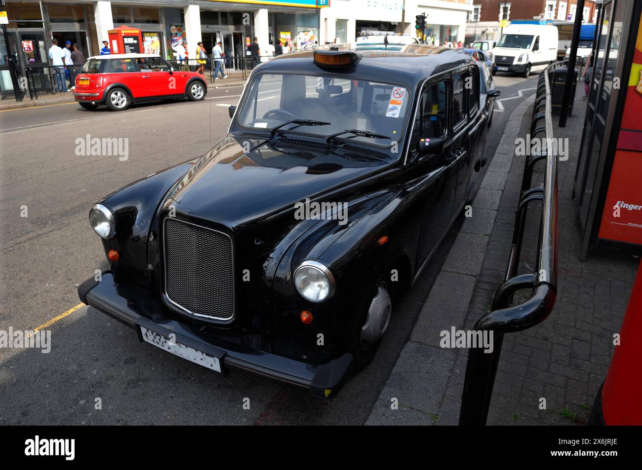 Waiting English black taxi at Tooting Broadway underground station ...