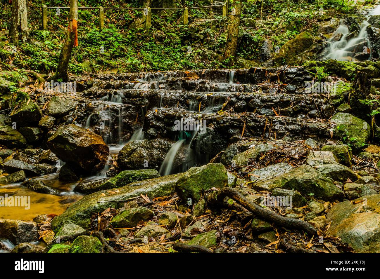 Serene waterfall cascades over mossy hi-res stock photography and ...