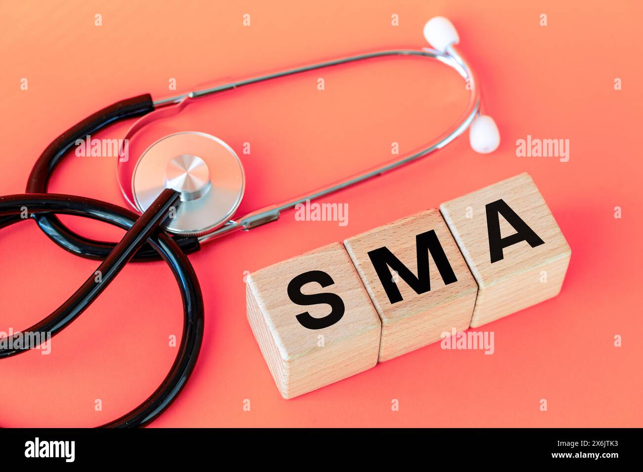 SMA disease symbol, spinal muscular atrophy, Written on wooden blocks ...